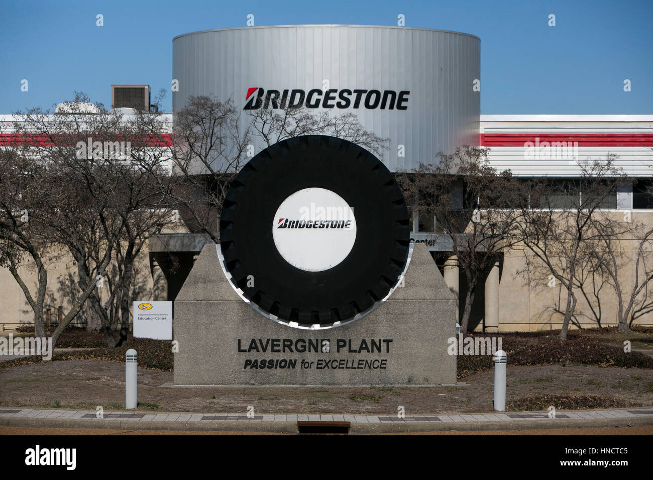 A logo sign outside of a facility occupied by the Bridgestone ...