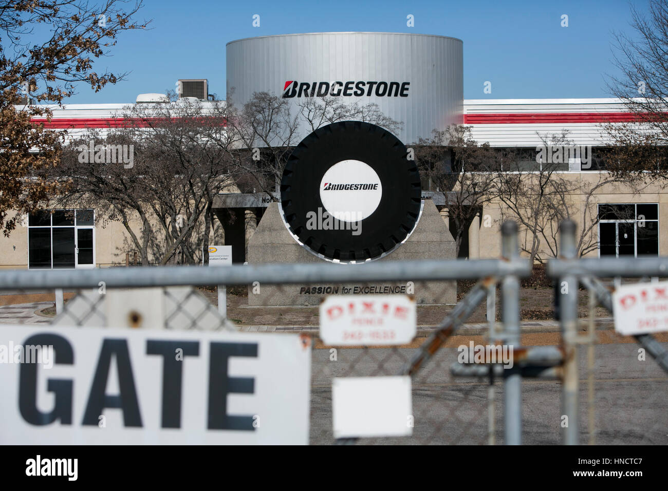 A logo sign outside of a facility occupied by the Bridgestone ...