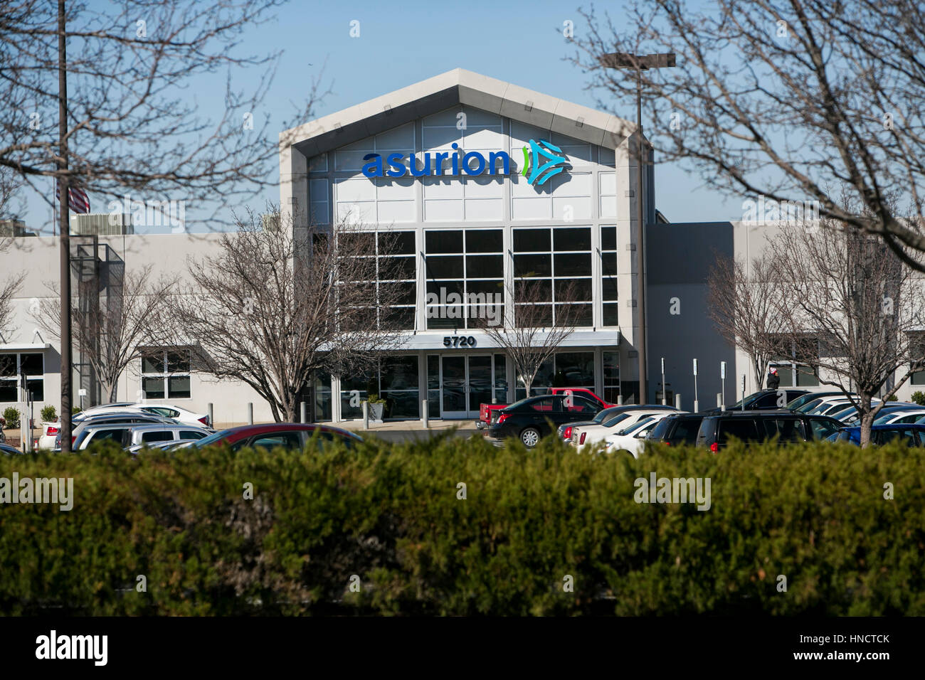 A logo sign outside of a facility occupied by Asurion in La Vergne ...