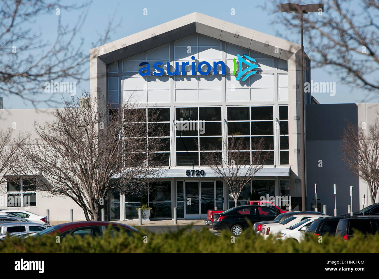 A logo sign outside of a facility occupied by Asurion in La Vergne ...