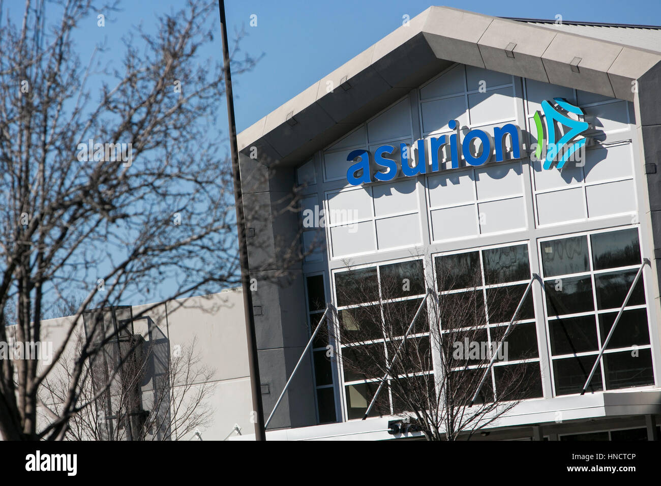 A logo sign outside of a facility occupied by Asurion in La Vergne ...