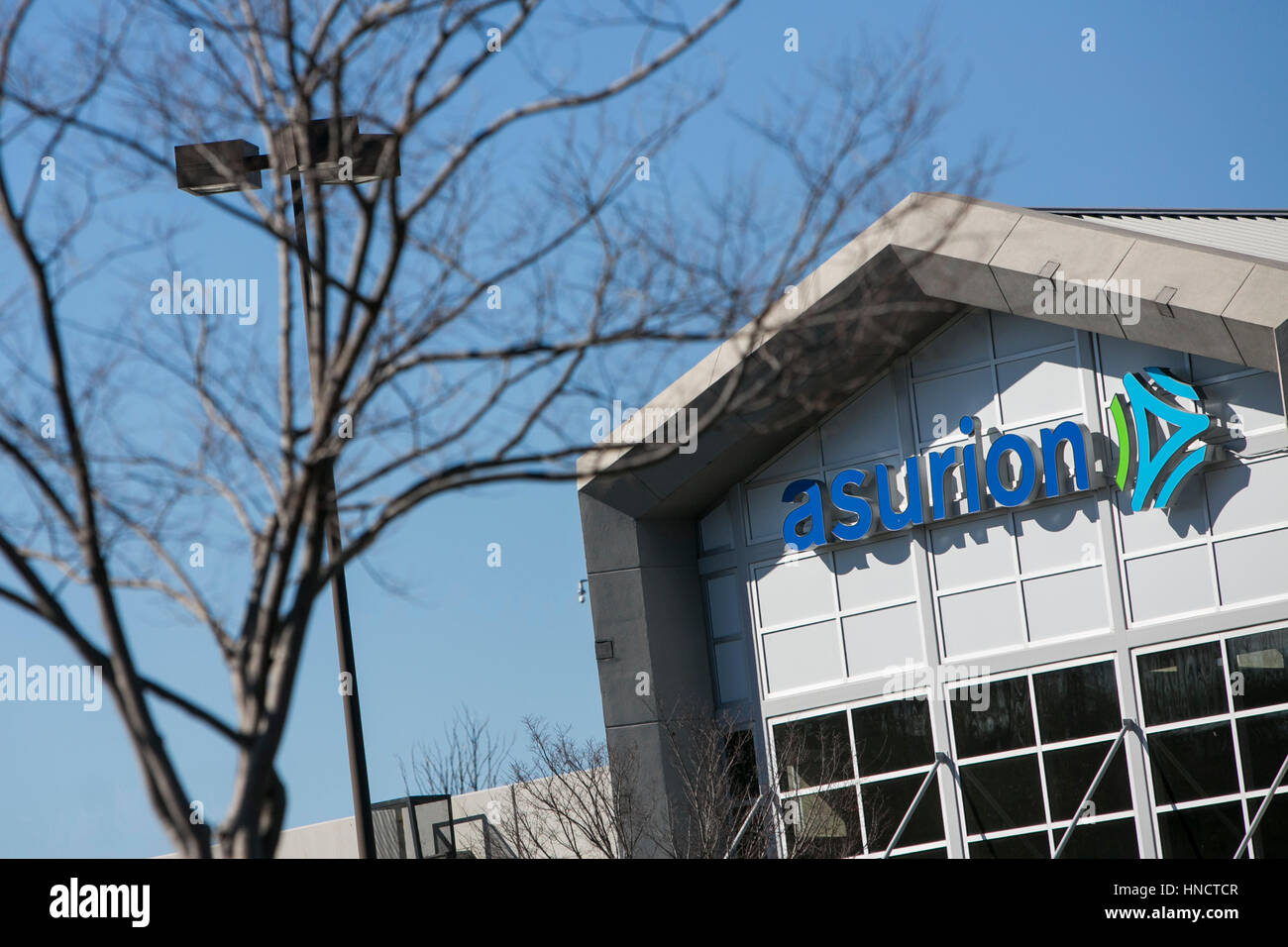 A logo sign outside of a facility occupied by Asurion in La Vergne ...
