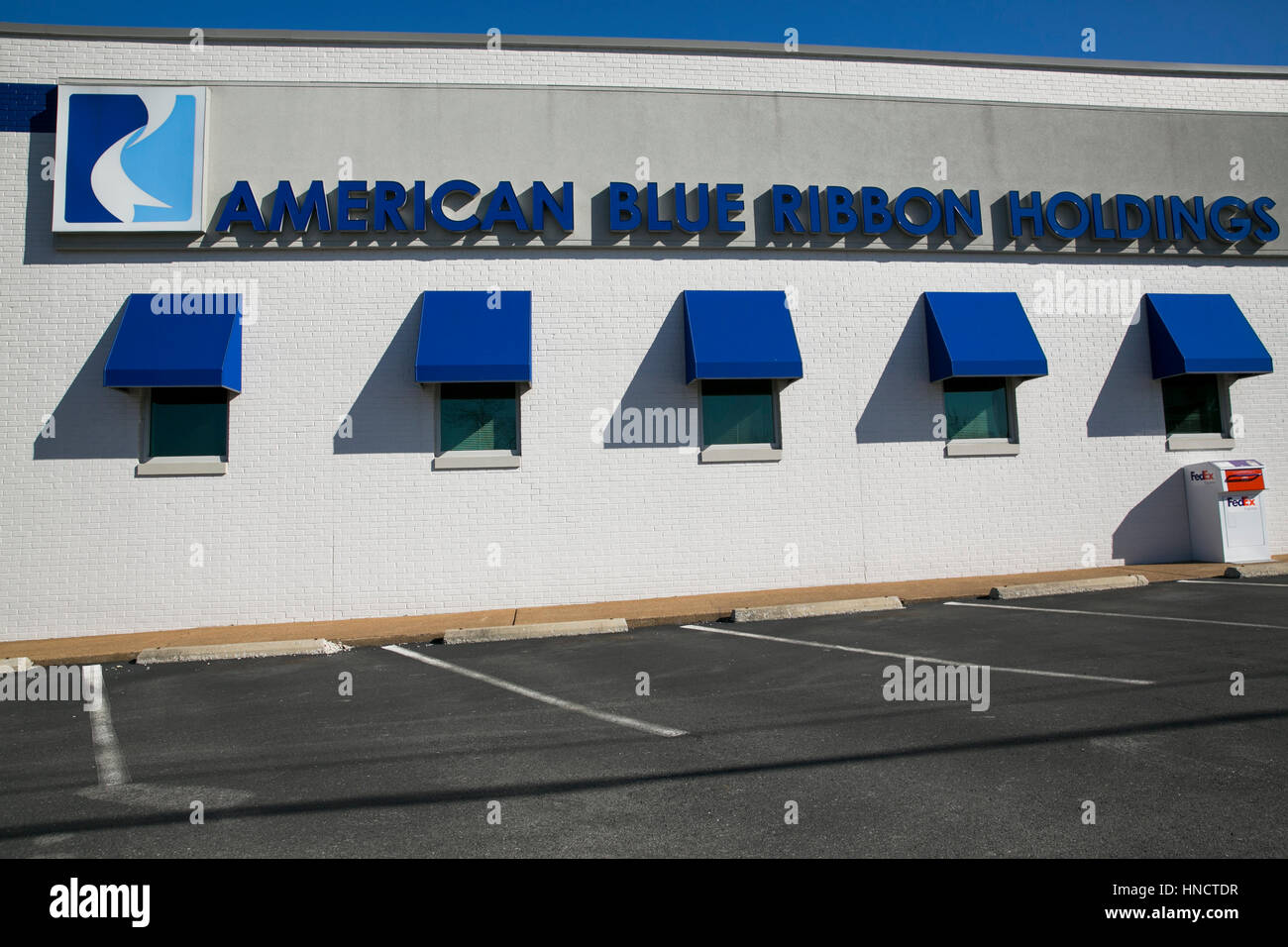 A logo sign outside of the headquarters of American Blue Ribbon ...