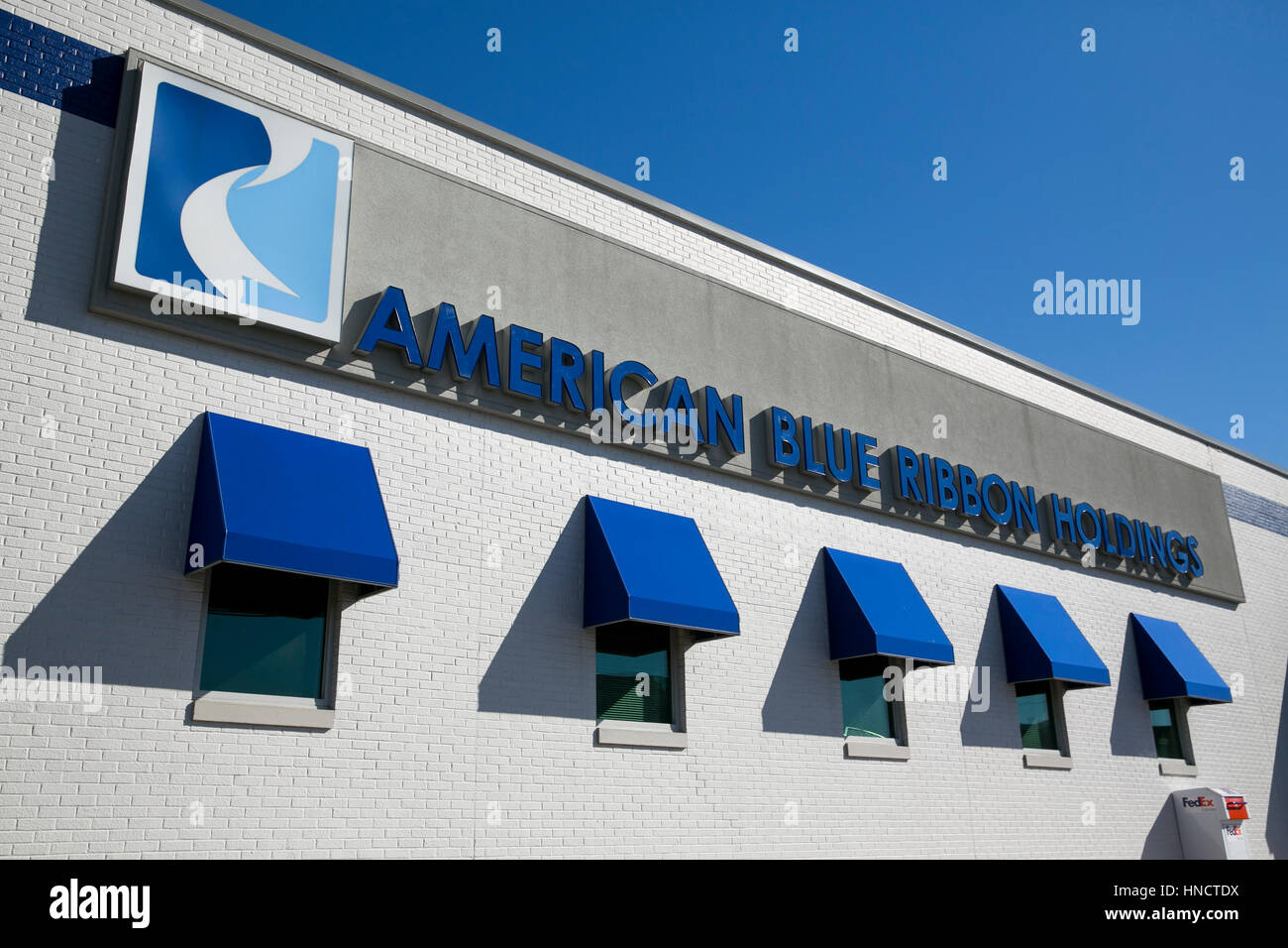 A logo sign outside of the headquarters of American Blue Ribbon ...