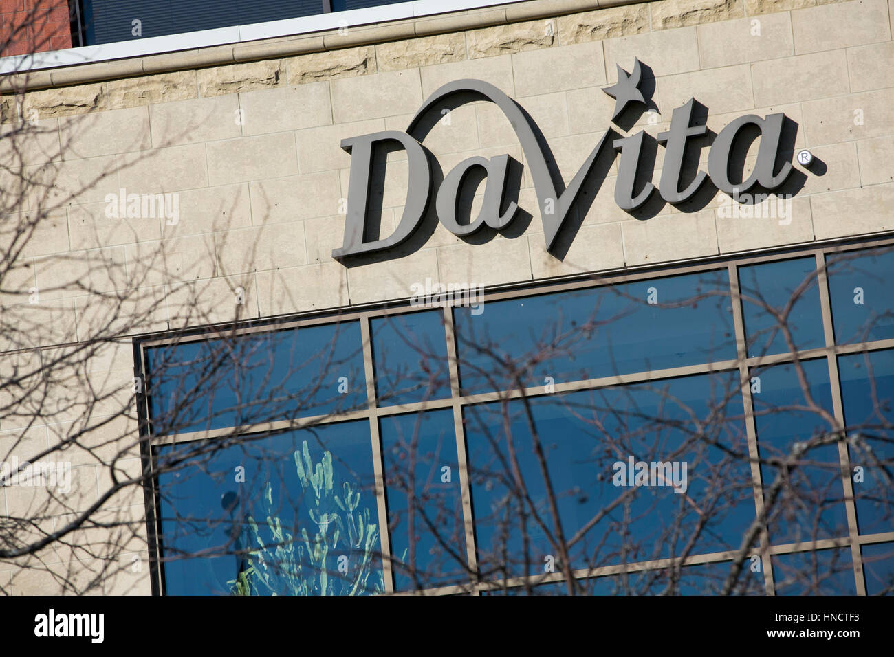 A logo sign outside of a facility occupied by DaVita, Inc., in ...