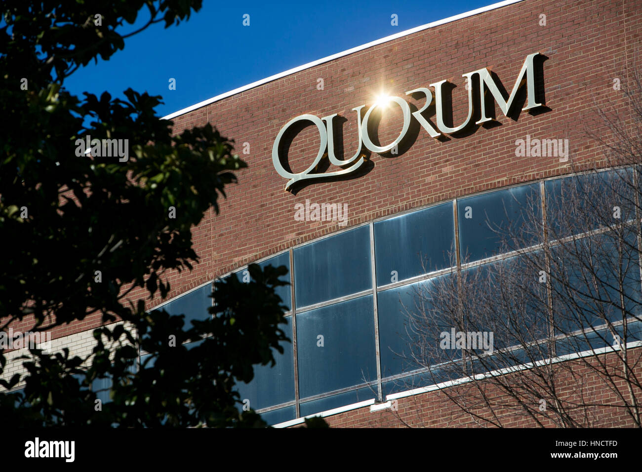 A logo sign outside of the headquarters of Quorum Health Resources in ...