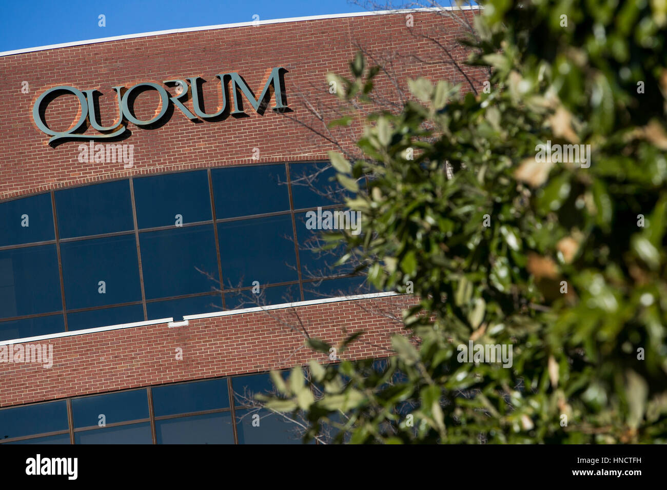 A logo sign outside of the headquarters of Quorum Health Resources in ...