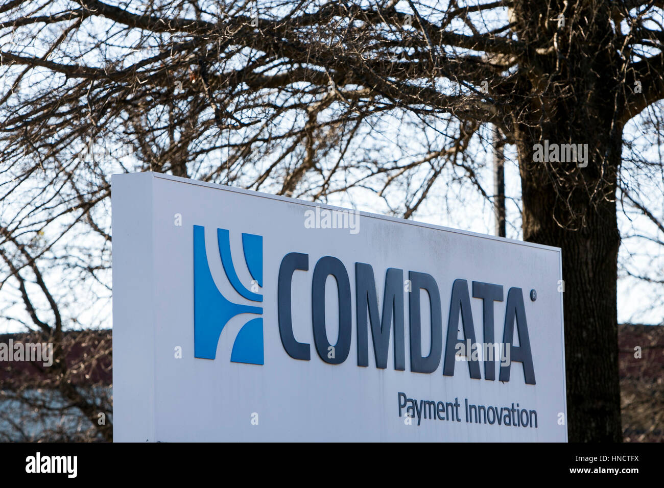 A logo sign outside of the headquarters of Comdata in Brentwood ...