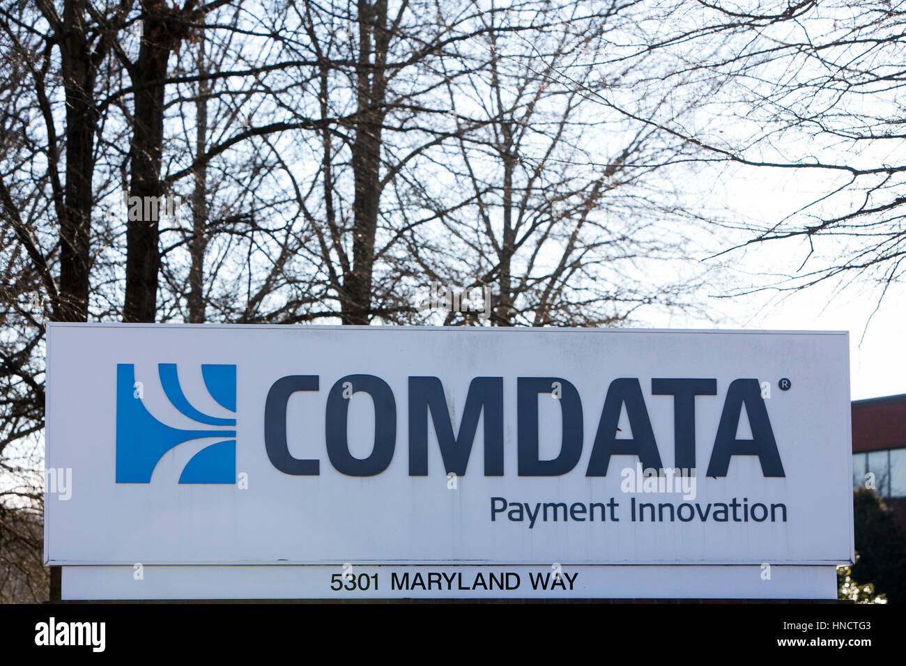 A logo sign outside of the headquarters of Comdata in Brentwood ...