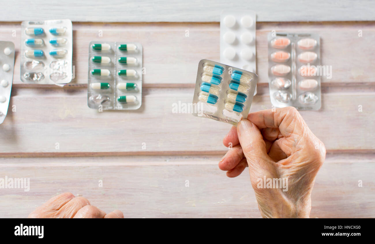 Different drugs table hands hi-res stock photography and images - Alamy