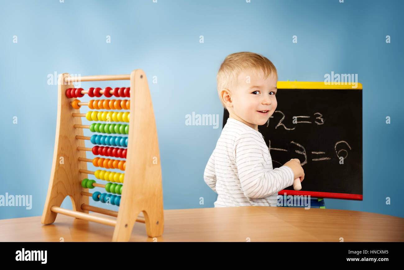 Child Writing Numbers On Chalkboard Stock Photo Alamy child-writing-numbers-on-chalkboard-stock-photo-alamy