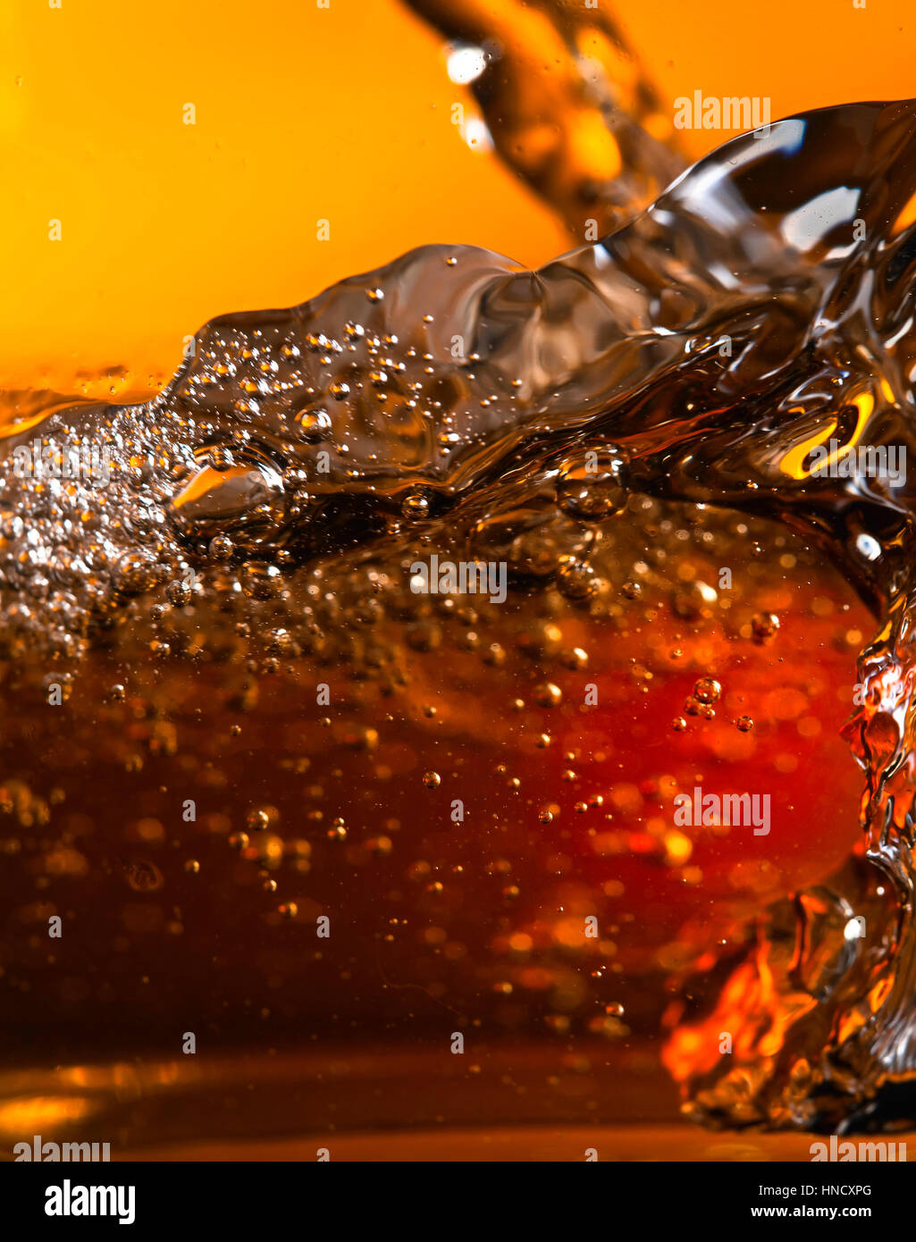 detail of an alcoholic beverage on yellow background Stock Photo - Alamy