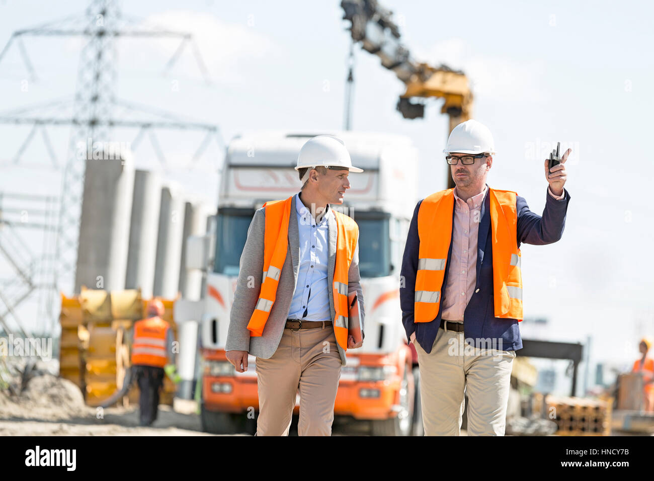 Supervisors discussing at construction site Stock Photo - Alamy