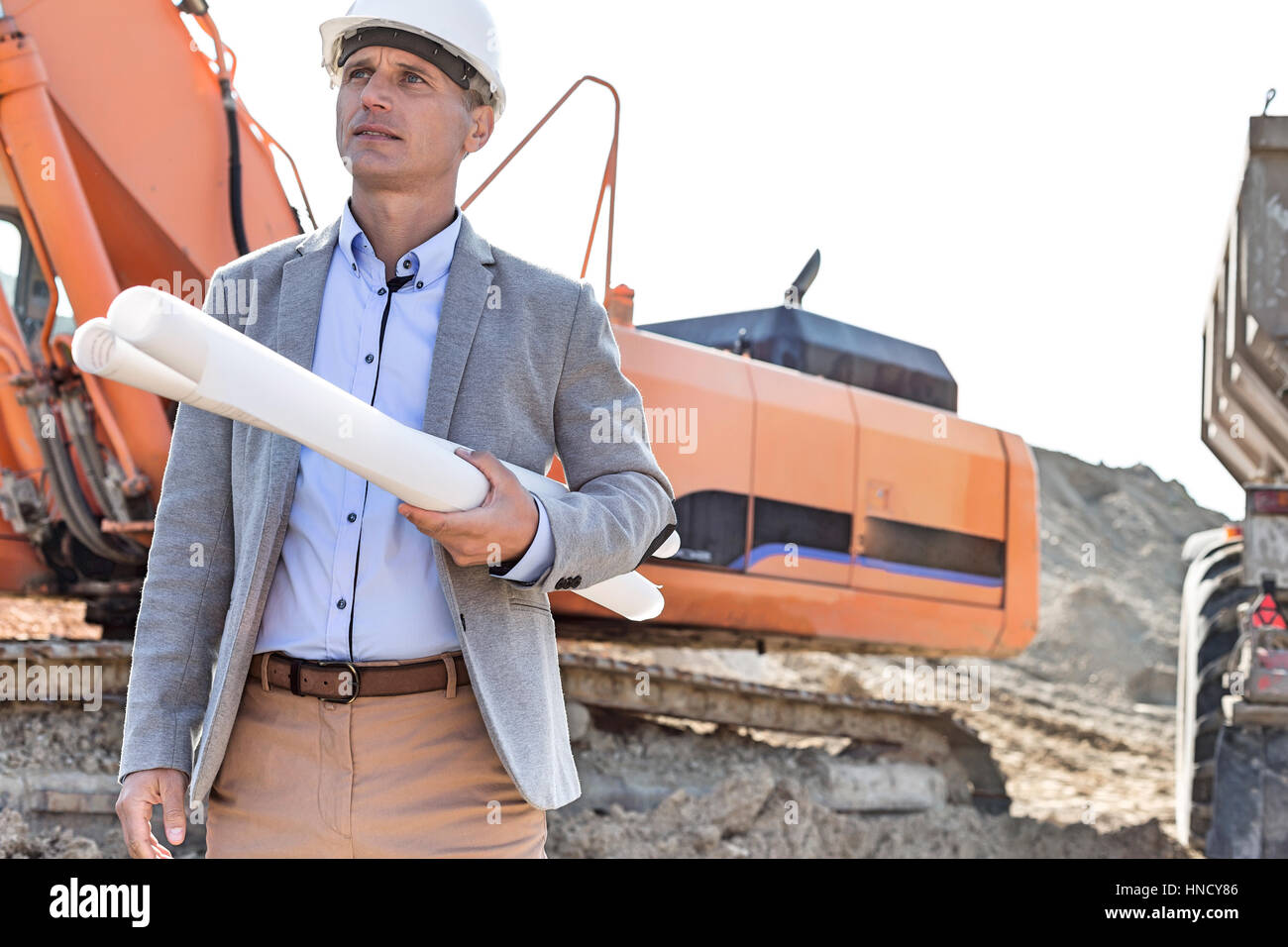 Construction holding building plans hi-res stock photography and images ...