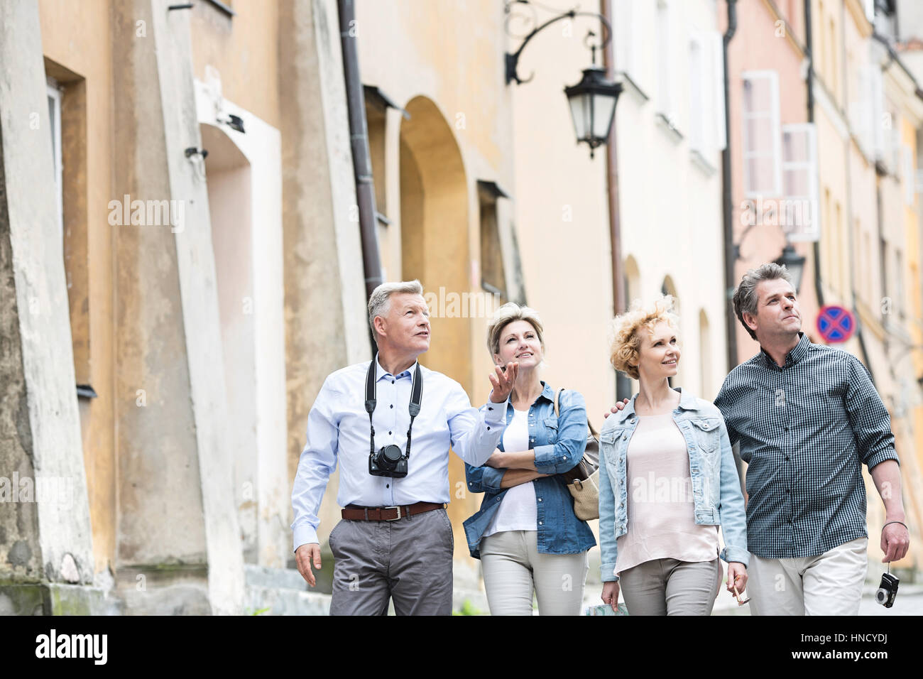 Four women friends walking hi-res stock photography and images - Alamy