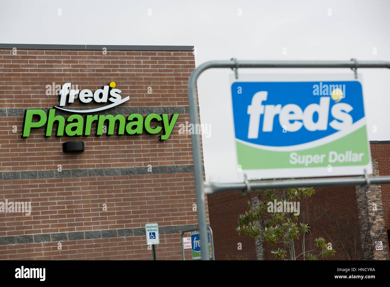 A logo sign outside of a Fred's Pharmacy in Olive Branch, Mississippi ...