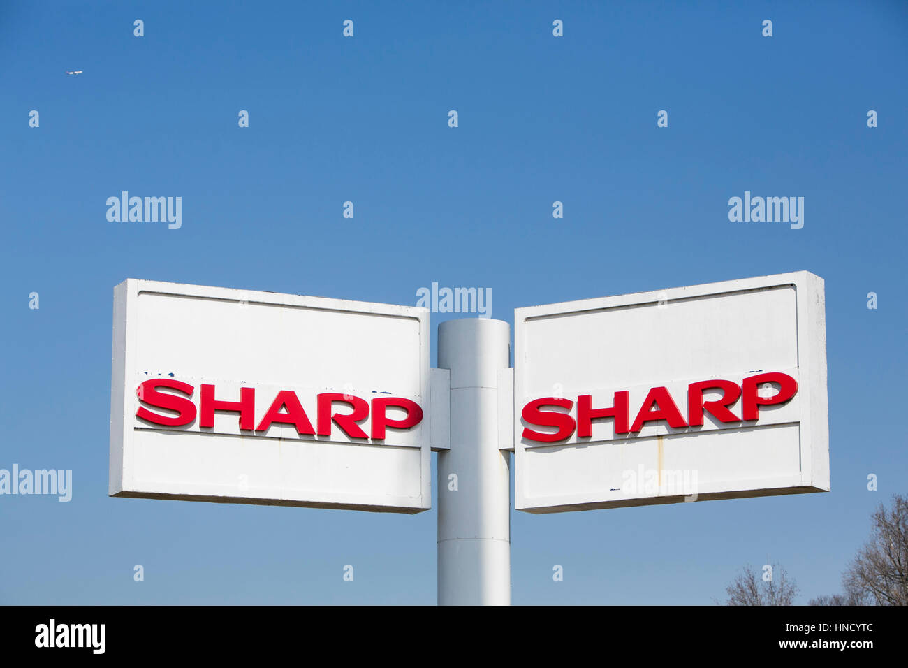 A logo sign outside of a facility occupied by the Sharp Corporation in ...
