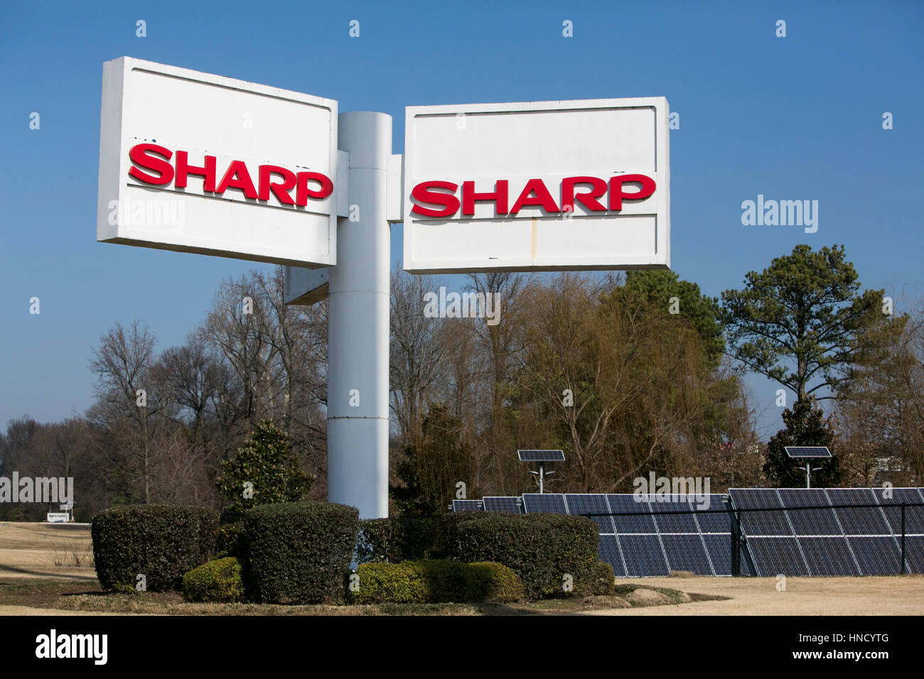 A logo sign outside of a facility occupied by the Sharp Corporation in ...