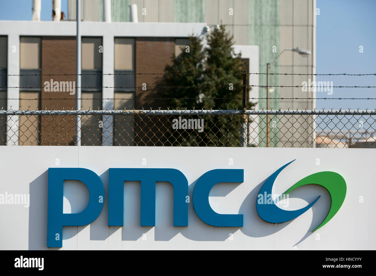 A logo sign outside of a facility occupied by PMC Biogenix in Memphis ...