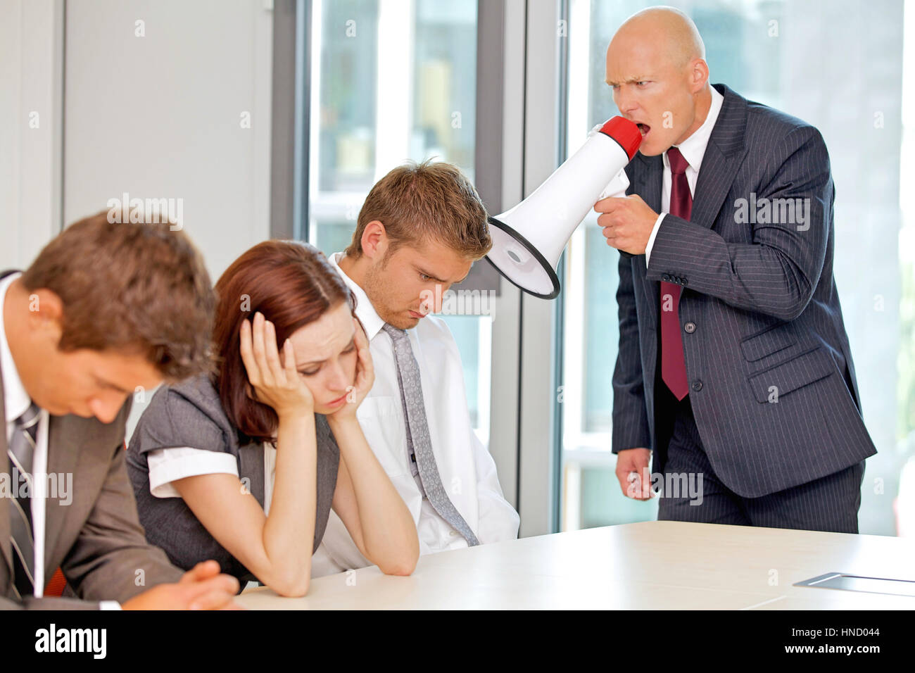 Young confident caucasian businessman screaming on his employee Stock ...