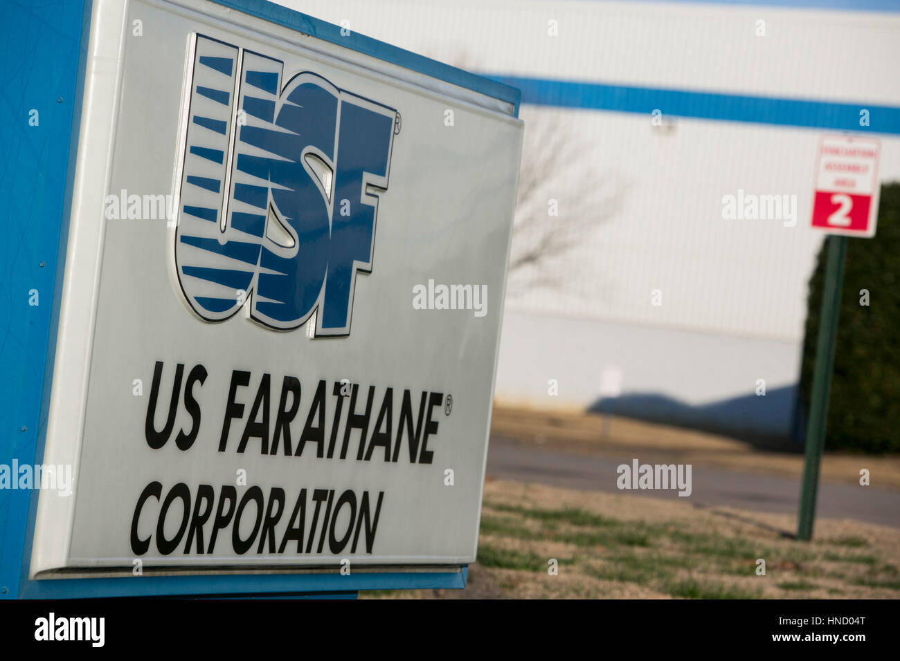 A logo sign outside of a facility occupied by the US Farathane ...