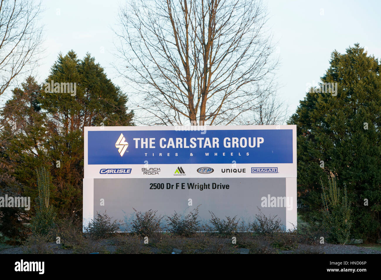 A logo sign outside of a facility occupied by The Carlstar Group in ...