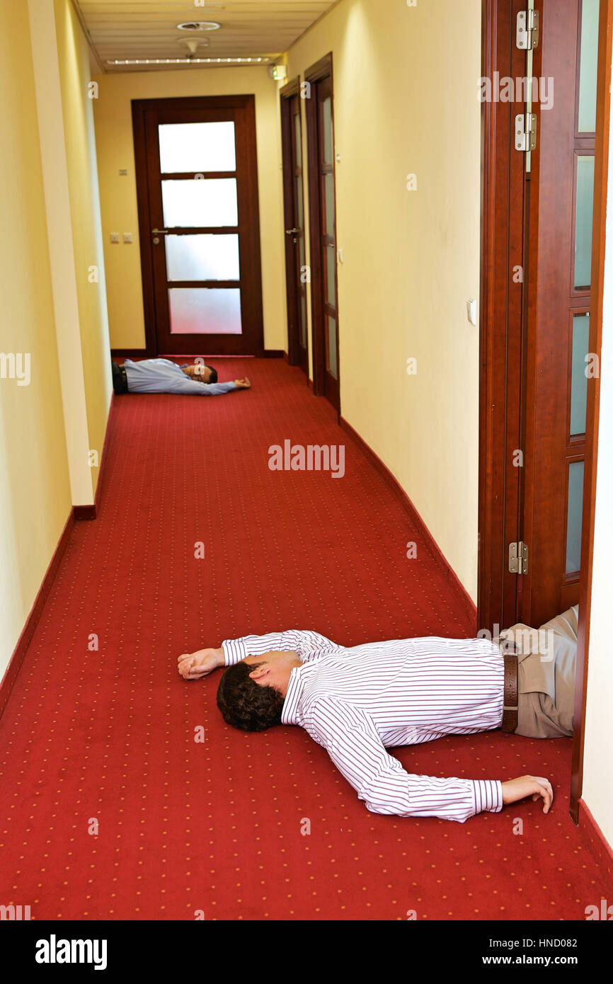 Two businessman lying down in office Stock Photo - Alamy