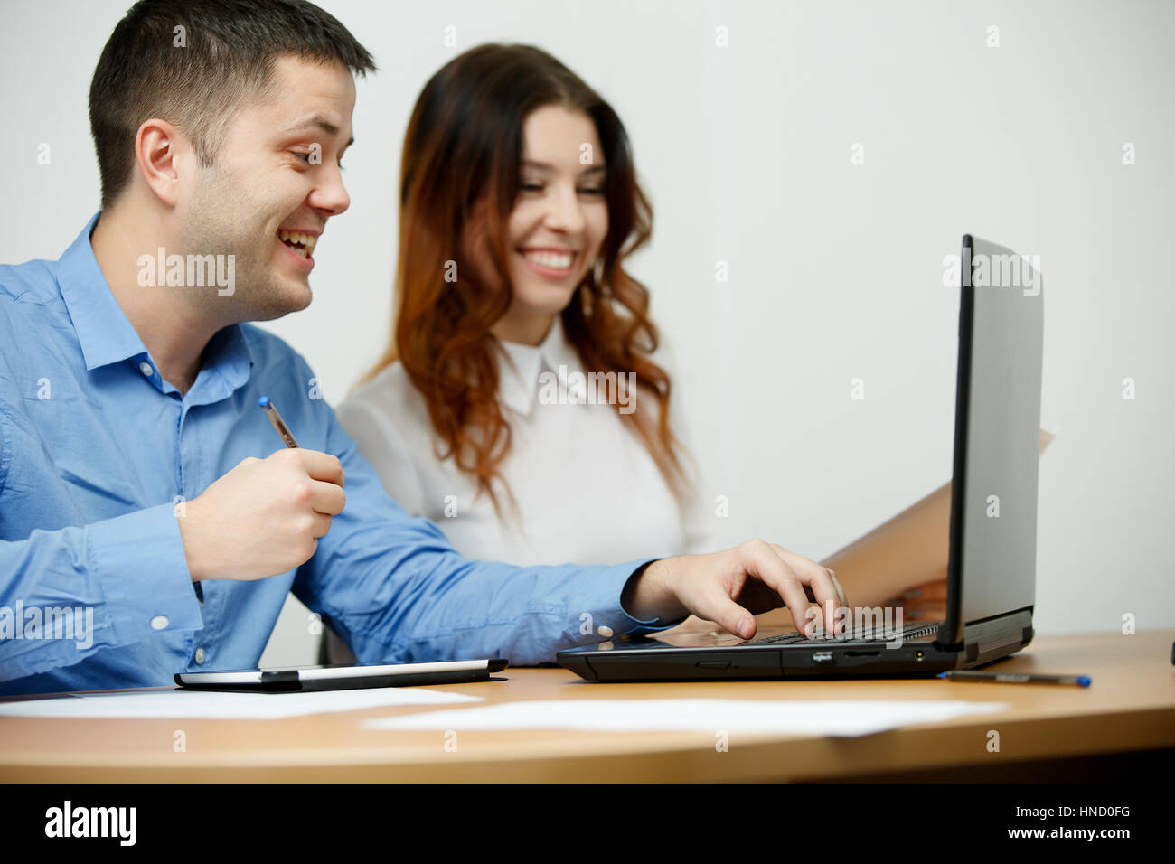 Young business people working with PC in office Stock Photo - Alamy