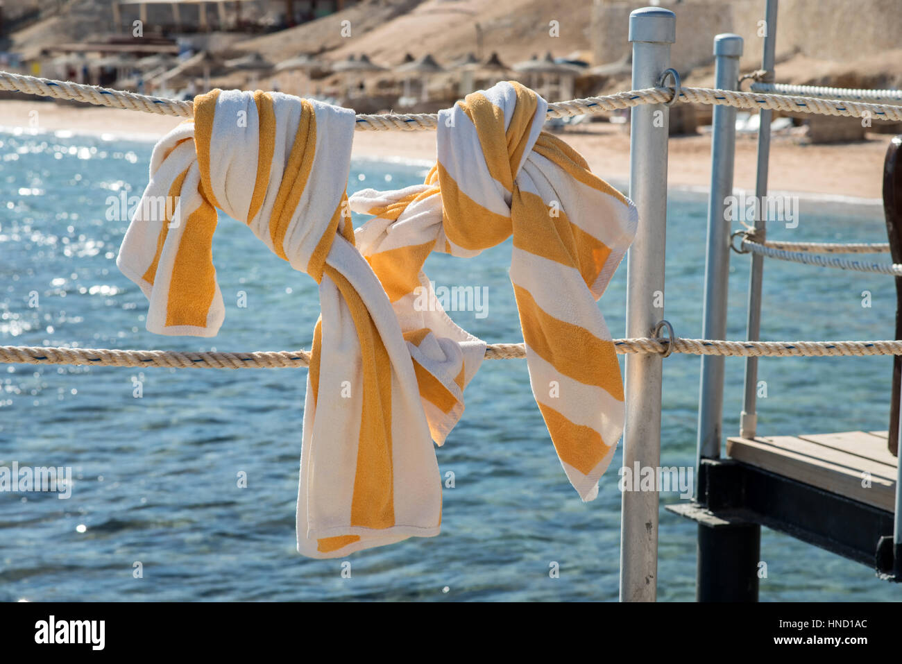 towels hang on the rope near the sea Stock Photo - Alamy