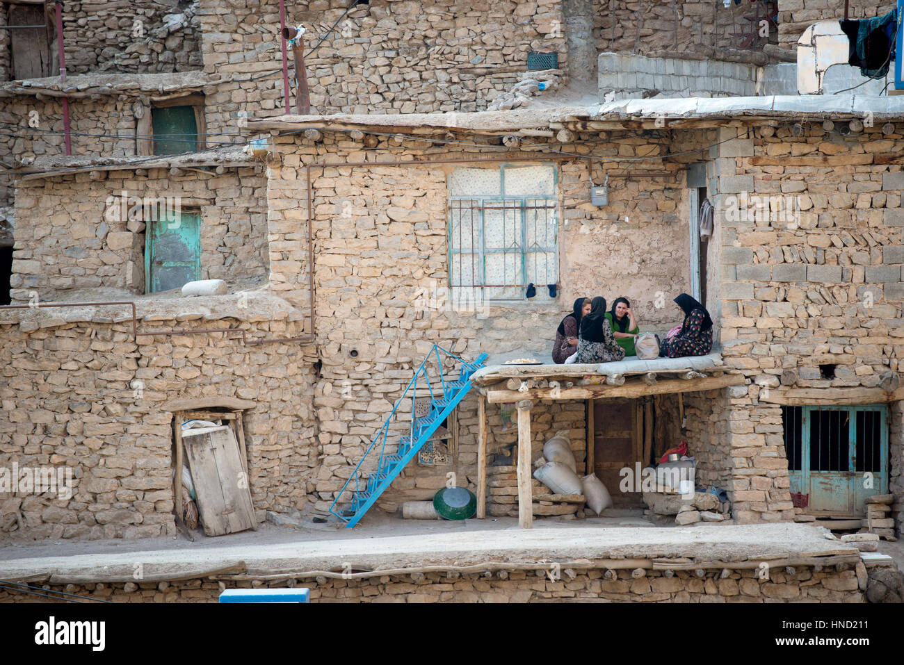 A group of kurdish women chatting seated, Palangan ancient village, Iranian Kurdistan, Iran ...