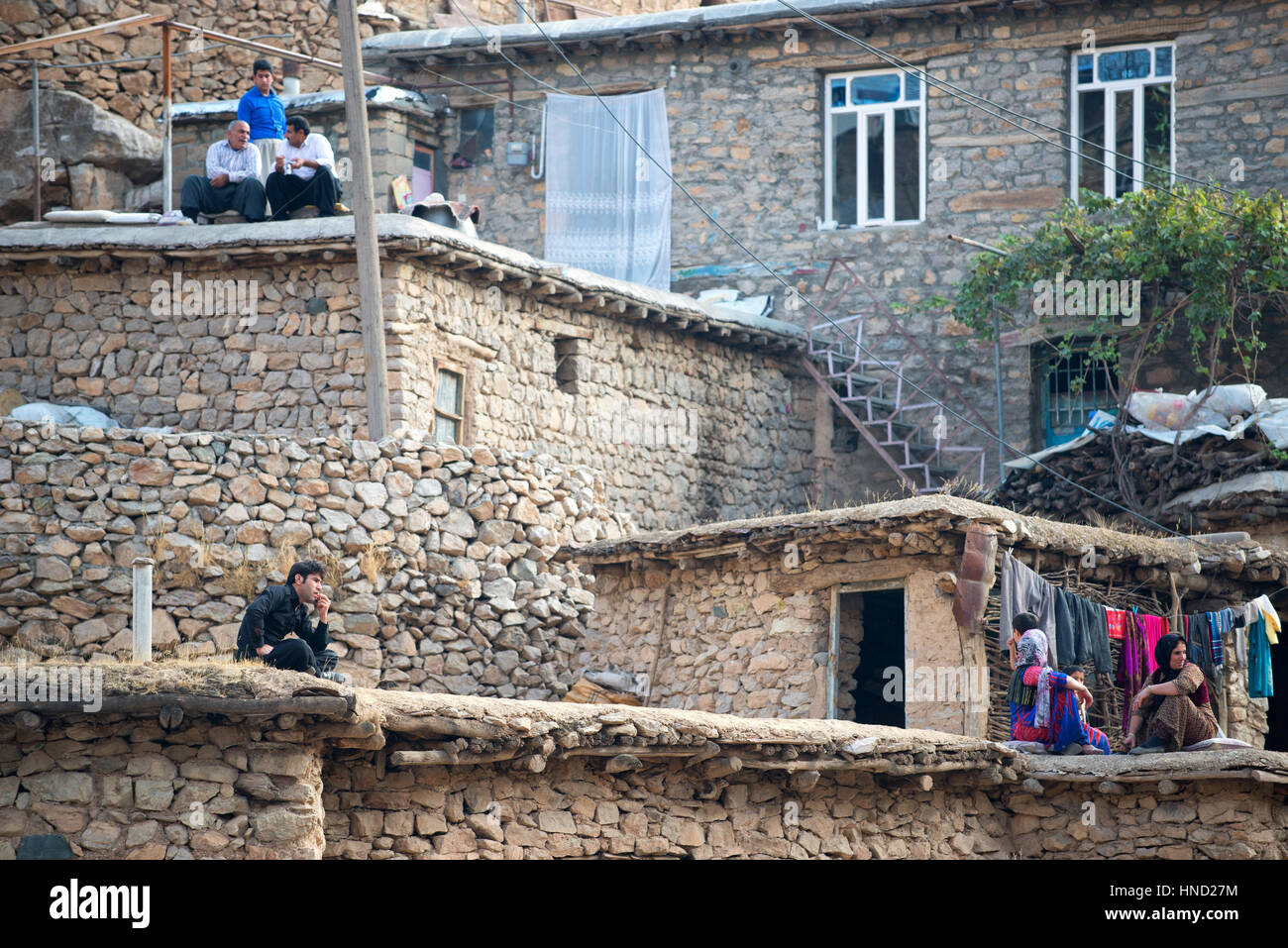 Kurd people sitting on the roof of traditional houses, Palangan ancient ...