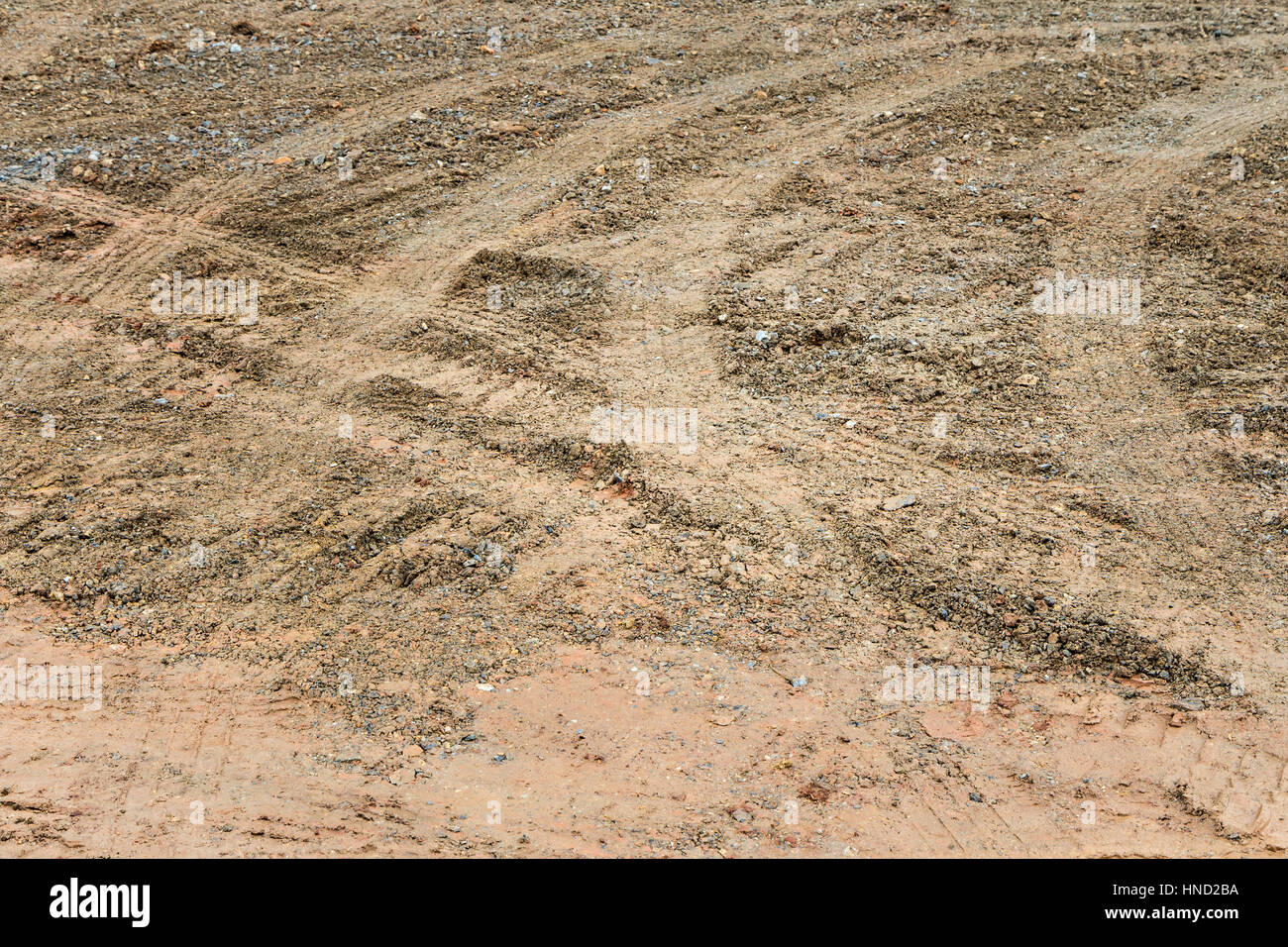Wheel tracks on red mud Stock Photo - Alamy