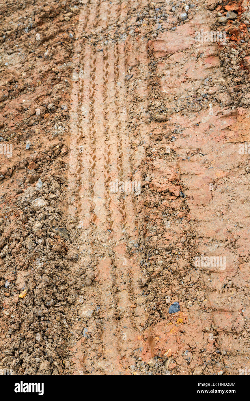 Wheel tracks on red mud Stock Photo - Alamy