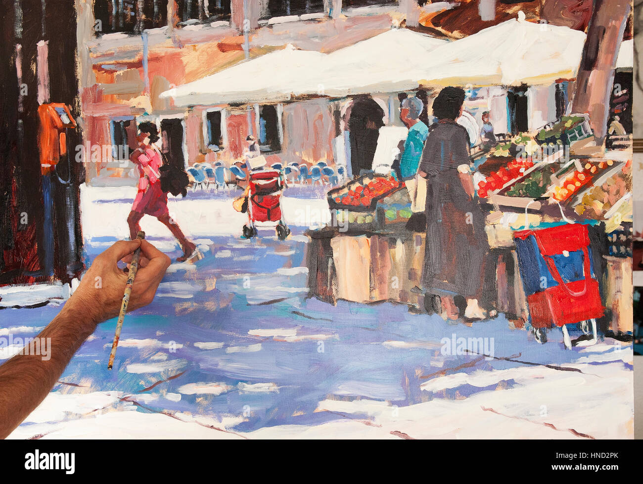 Artist adds finishing touches to painting Stock Photo - Alamy