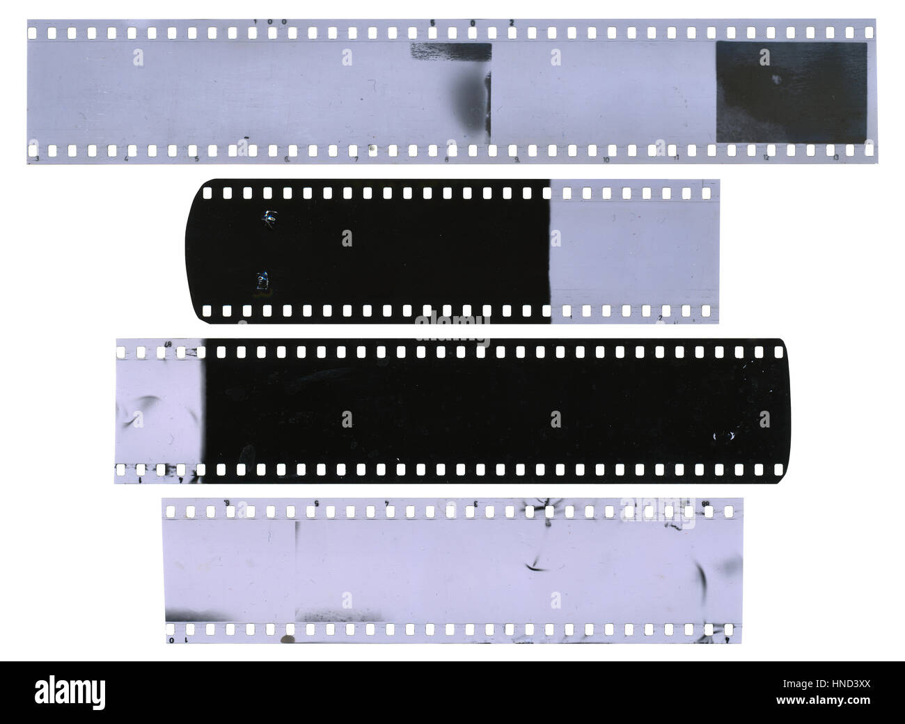 Old, used, dusty and scratched celluloid film strips isolated on white ...