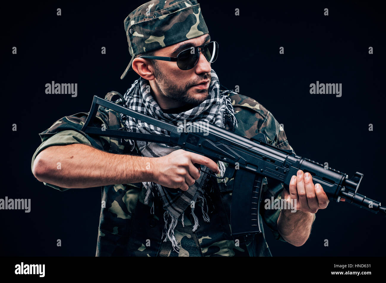 Terrorist sniper shooting with his weapon. Concept about terrorism ...