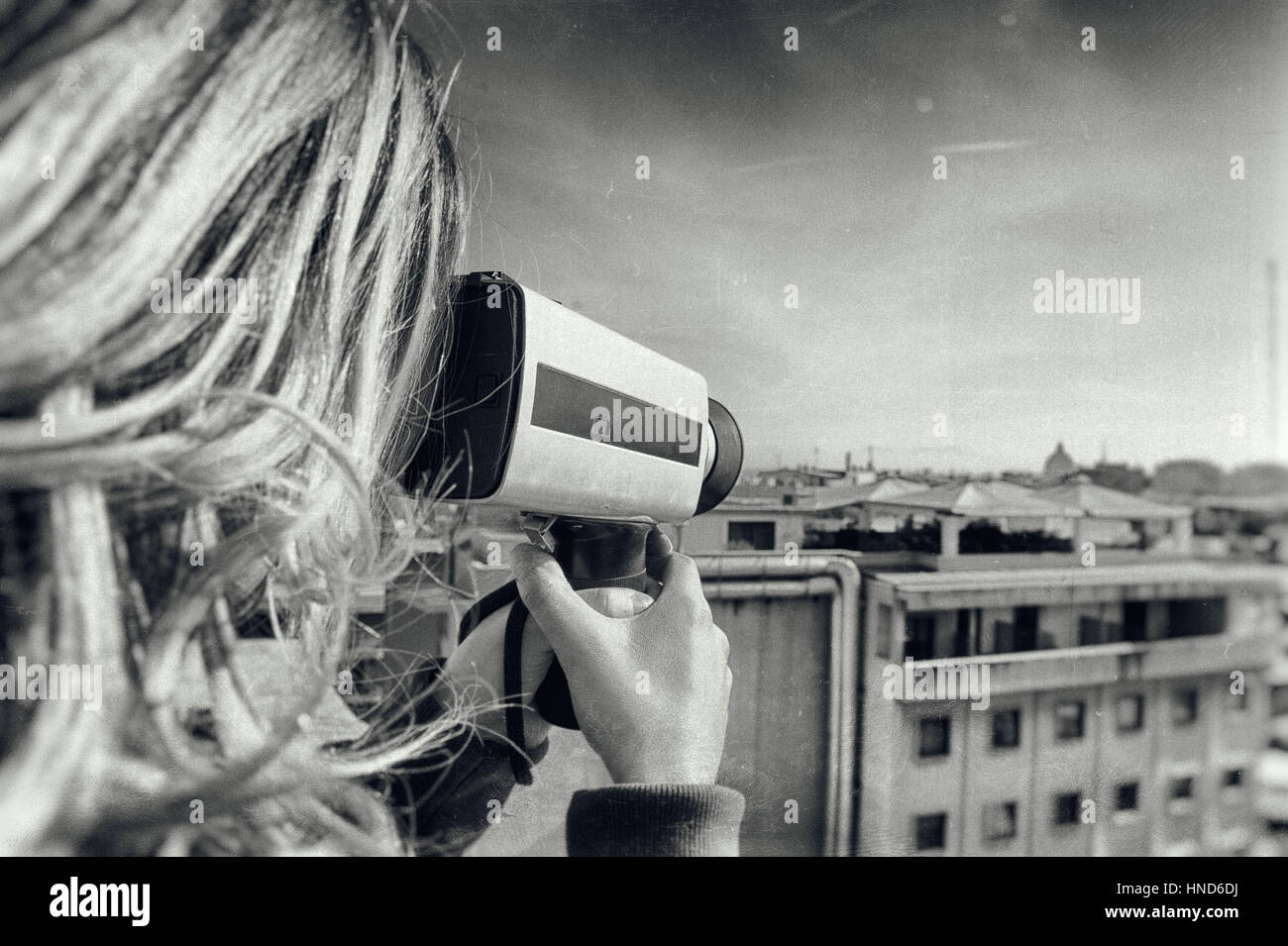 Blonde woman shooting Rome city skyline with St Peter Dome and vintage ...