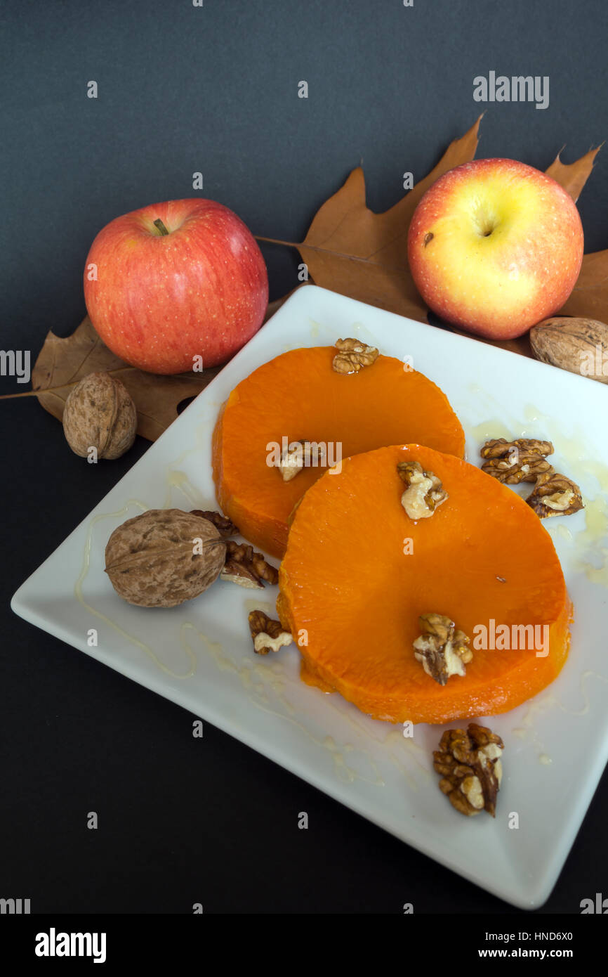 Roasted, baked pumpkin with addition of Honey and walnuts and autumn ...