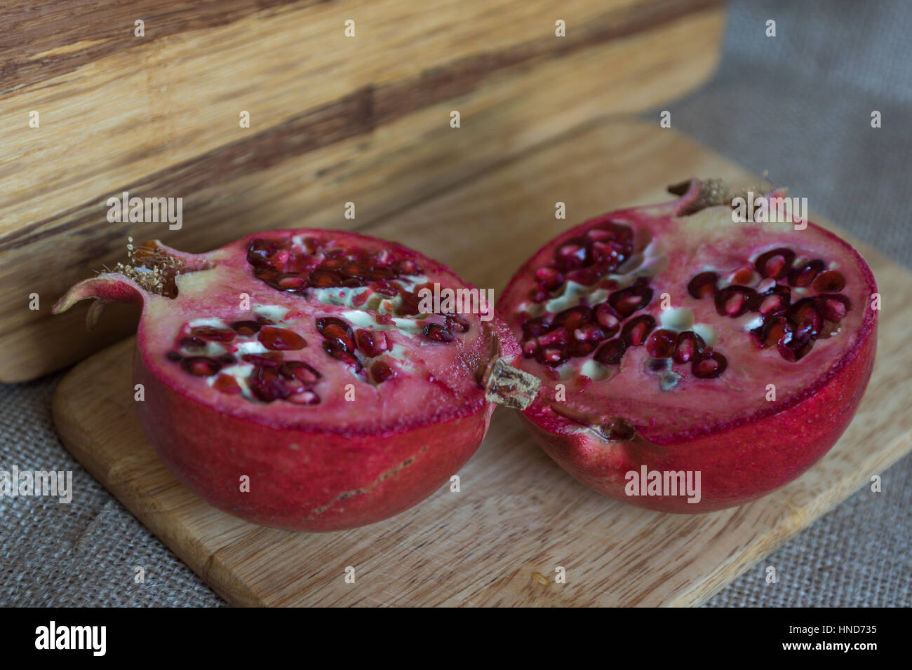Ripe pomegranate fruit on wooden vintage background Stock Photo - Alamy