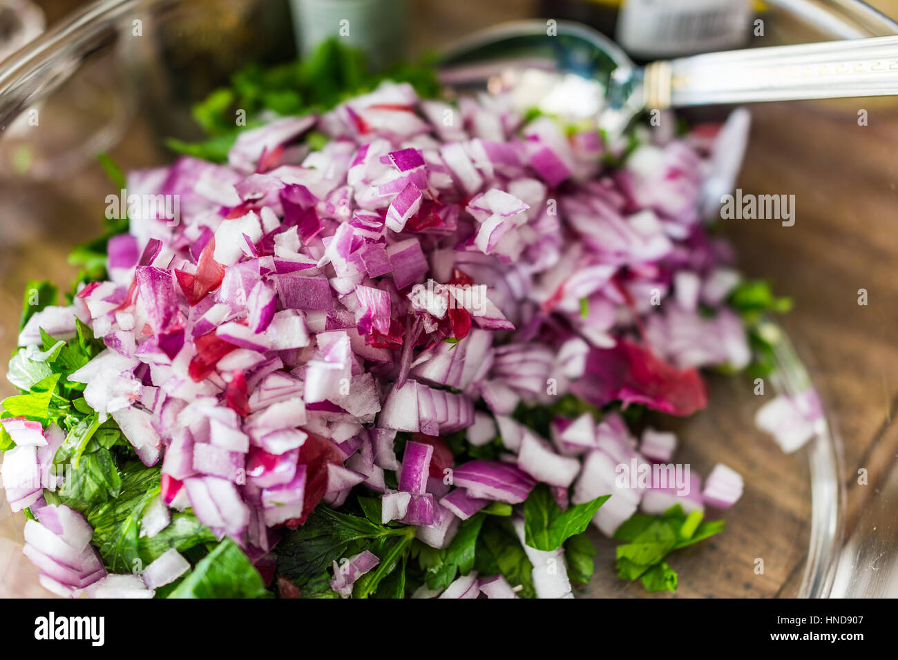 Diced red onion with cilantro in bowl Stock Photo - Alamy