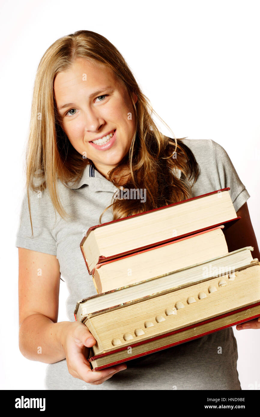 teen girl is carrying a stack of books Stock Photo - Alamy