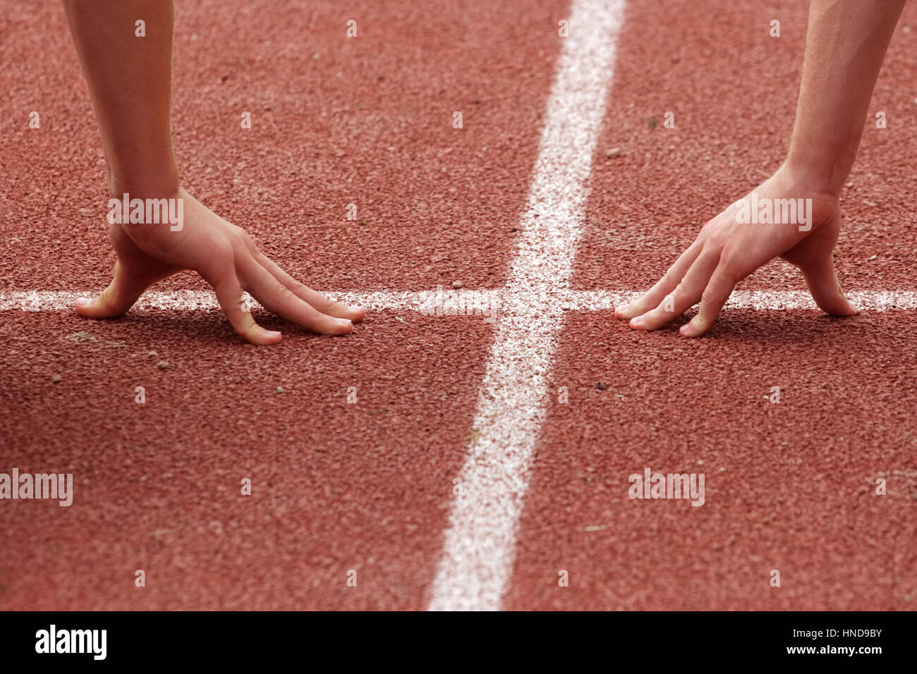 hands on the starting line of a track race Stock Photo - Alamy