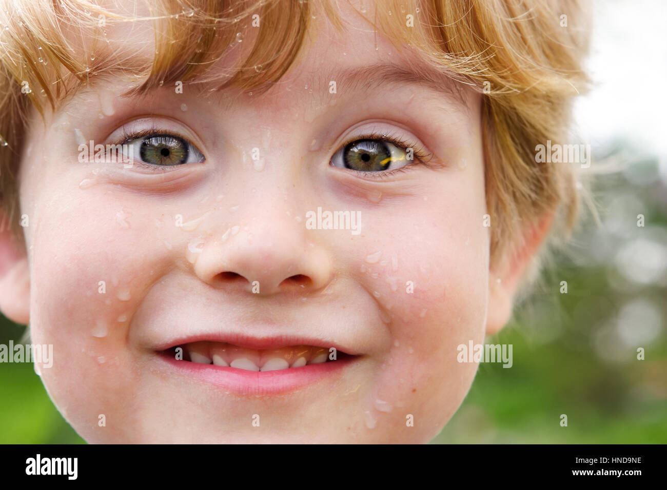close up of a boy with water splashed on his face Stock Photo - Alamy