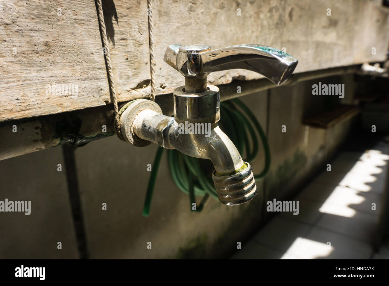 Stainless Steel faucet with water pipe line on a brick wall photo taken ...