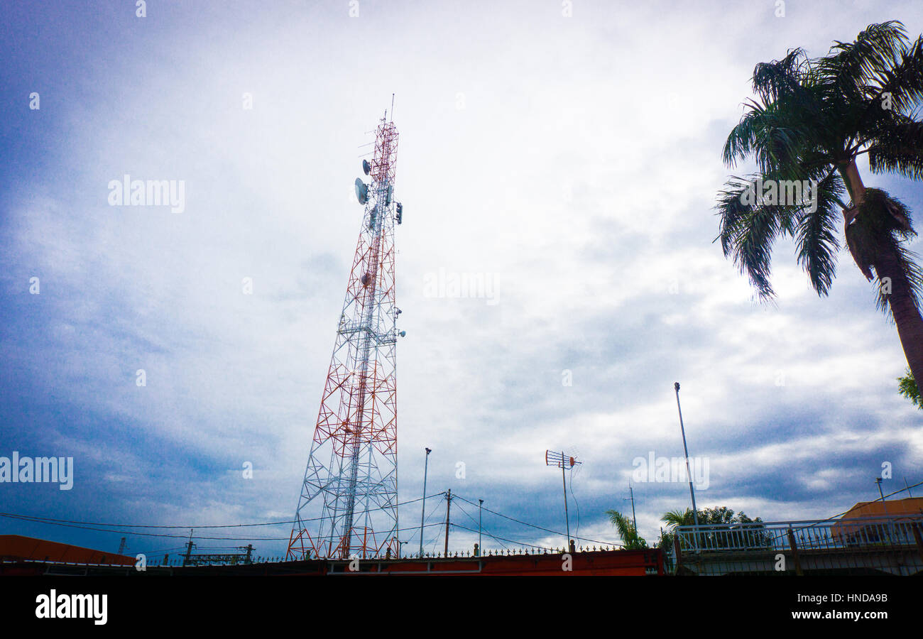 A telecommunication tower with cloudy sky as background photo taken in ...