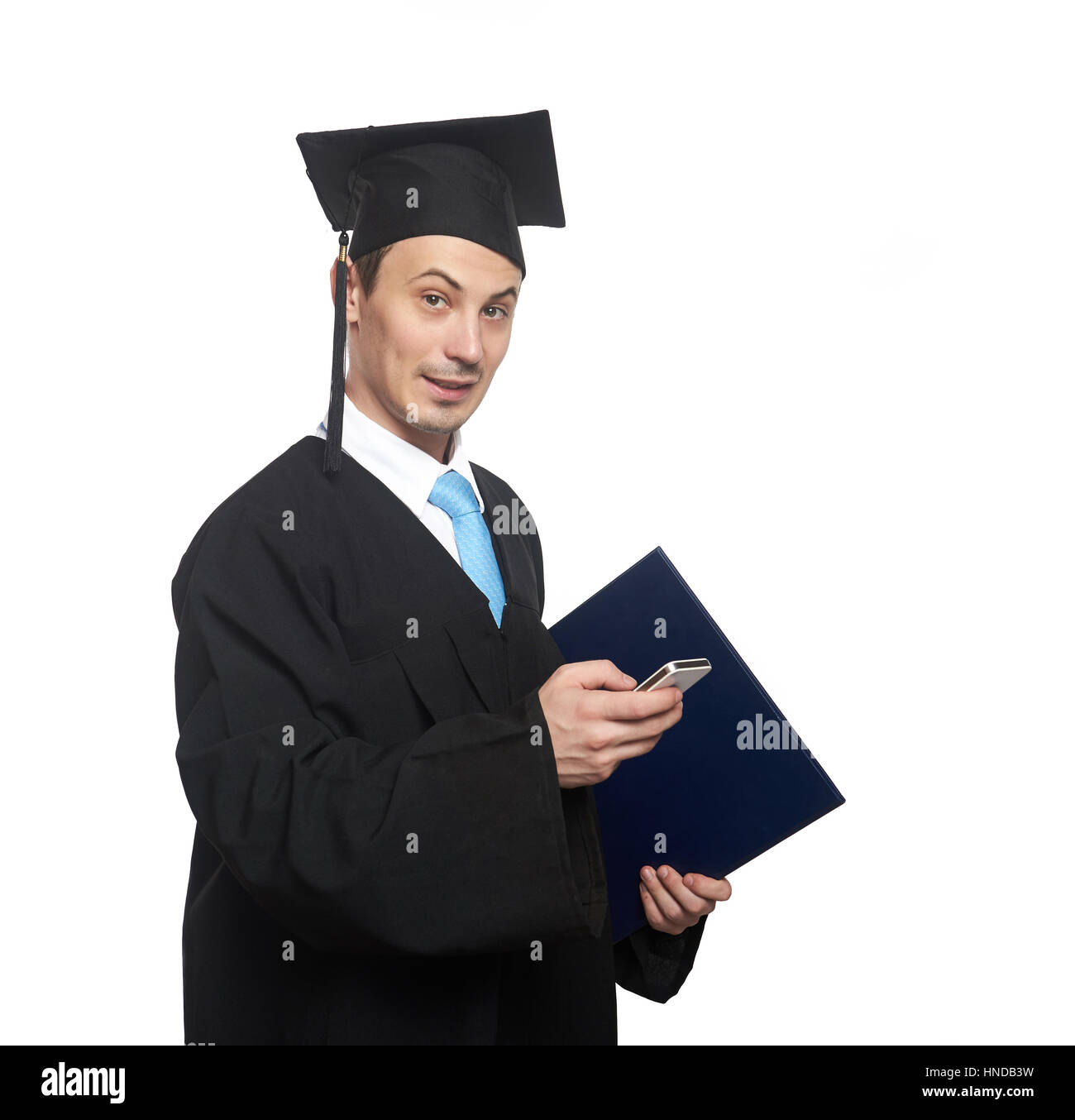Graduating student with smartphone isolated on white background Stock ...