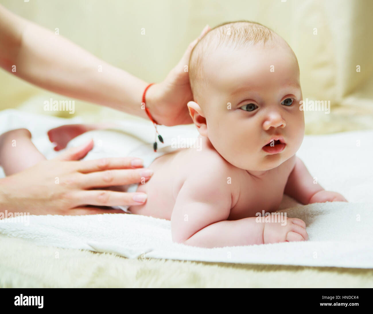 Baby massage hi-res stock photography and images - Alamy