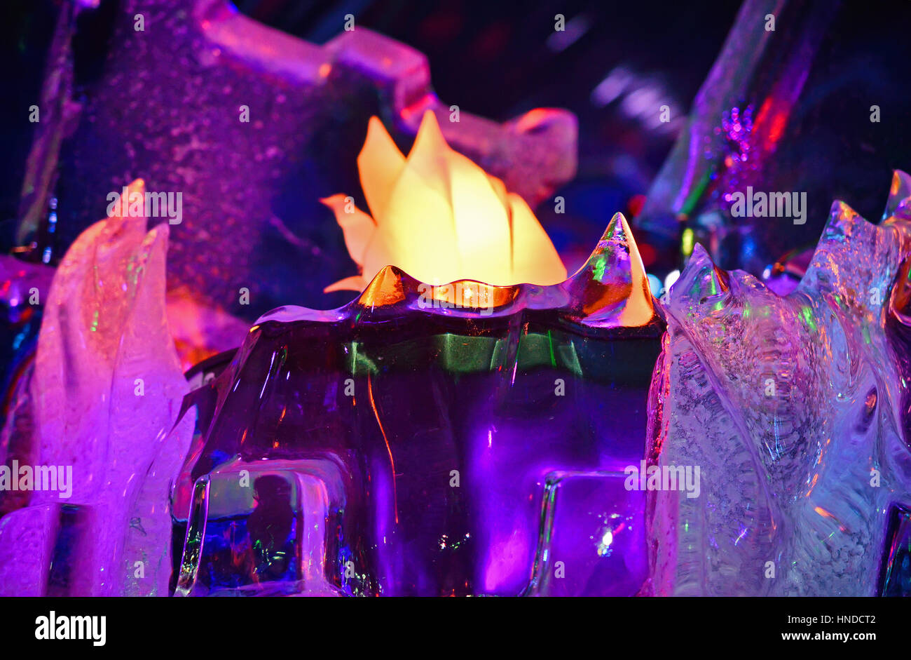 .Ice sculpture - burning torch with multicolored lights Stock Photo - Alamy