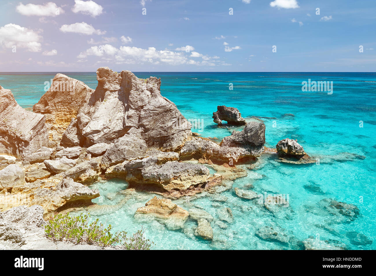 Big rock in coast of Bermuda island. Crystal clean blue water for ...