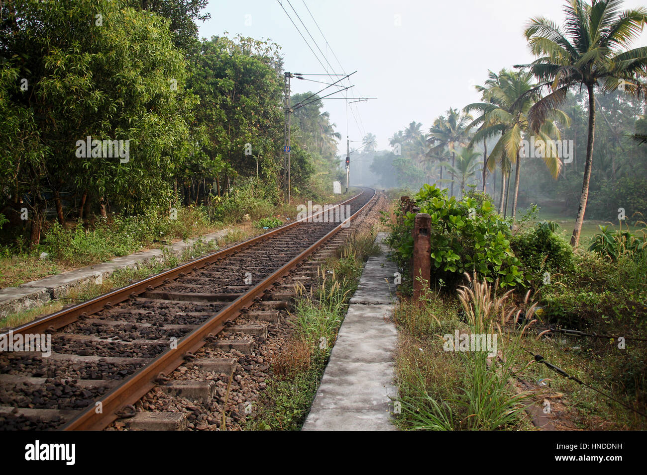 Rural train line running through Kerala, India Stock Photo - Alamy